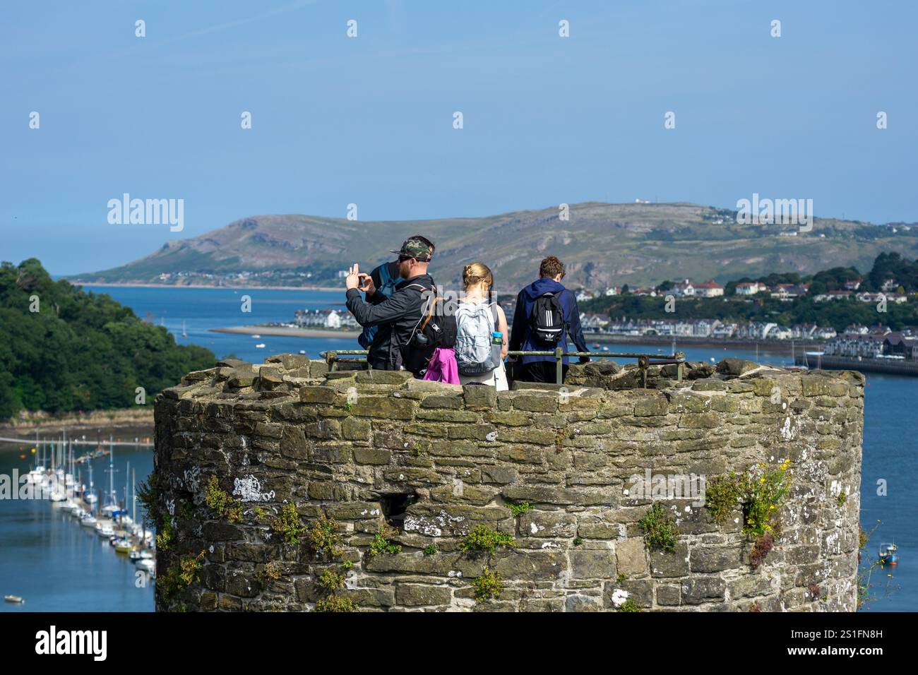 Conwy Wales - July 31 2024; Tourists exploring inside medieval Conwy ...