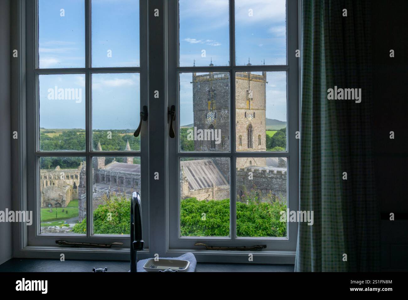View through multi-paned window over St David's Castle and ...