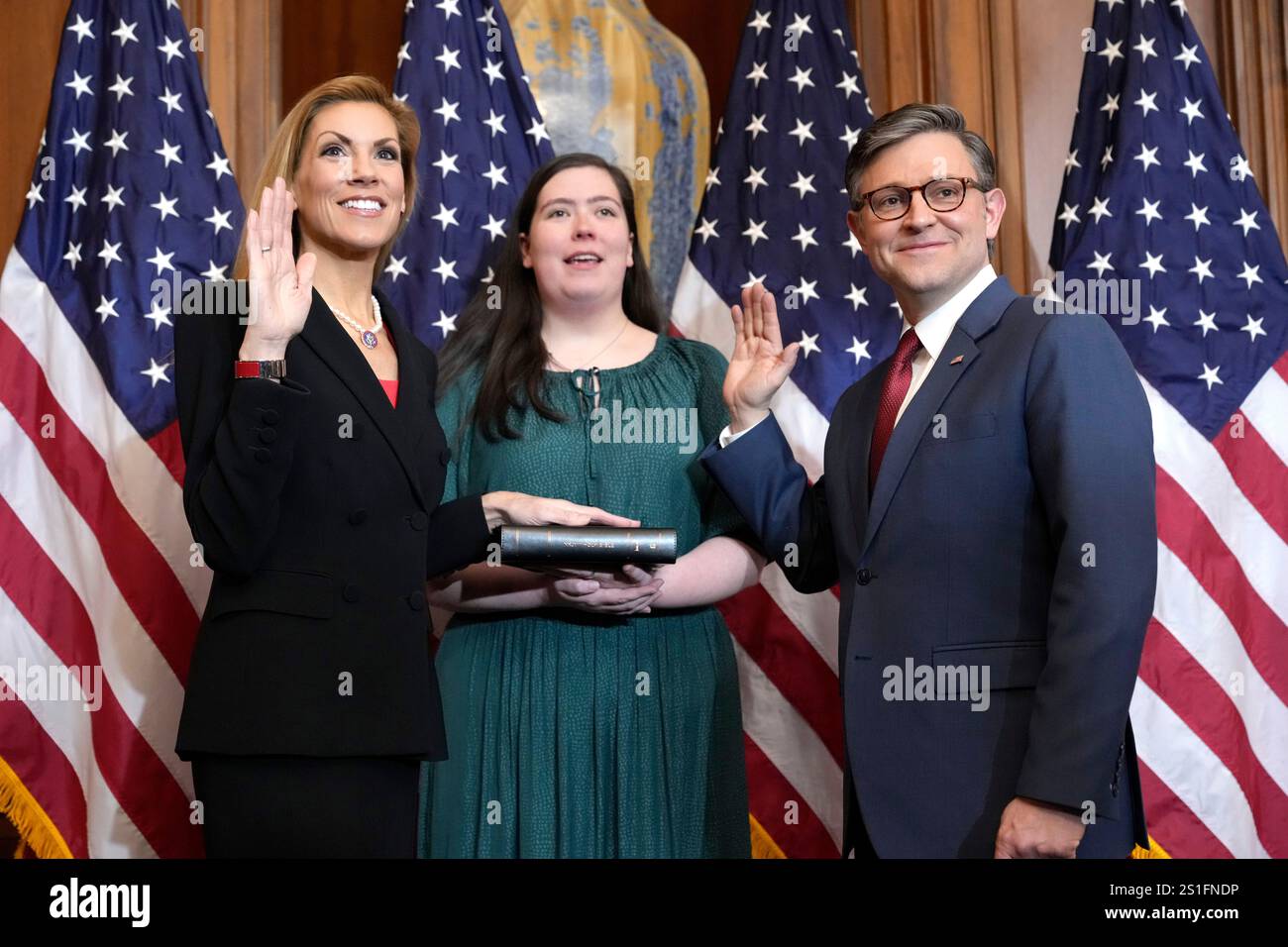House Speaker Mike Johnson, R-La., right, poses during a ceremonial ...