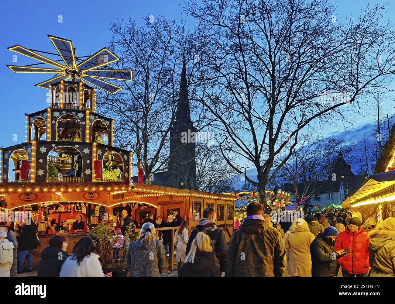 Christmas market with Christmas pyramid and St Joseph's Catholic Church ...