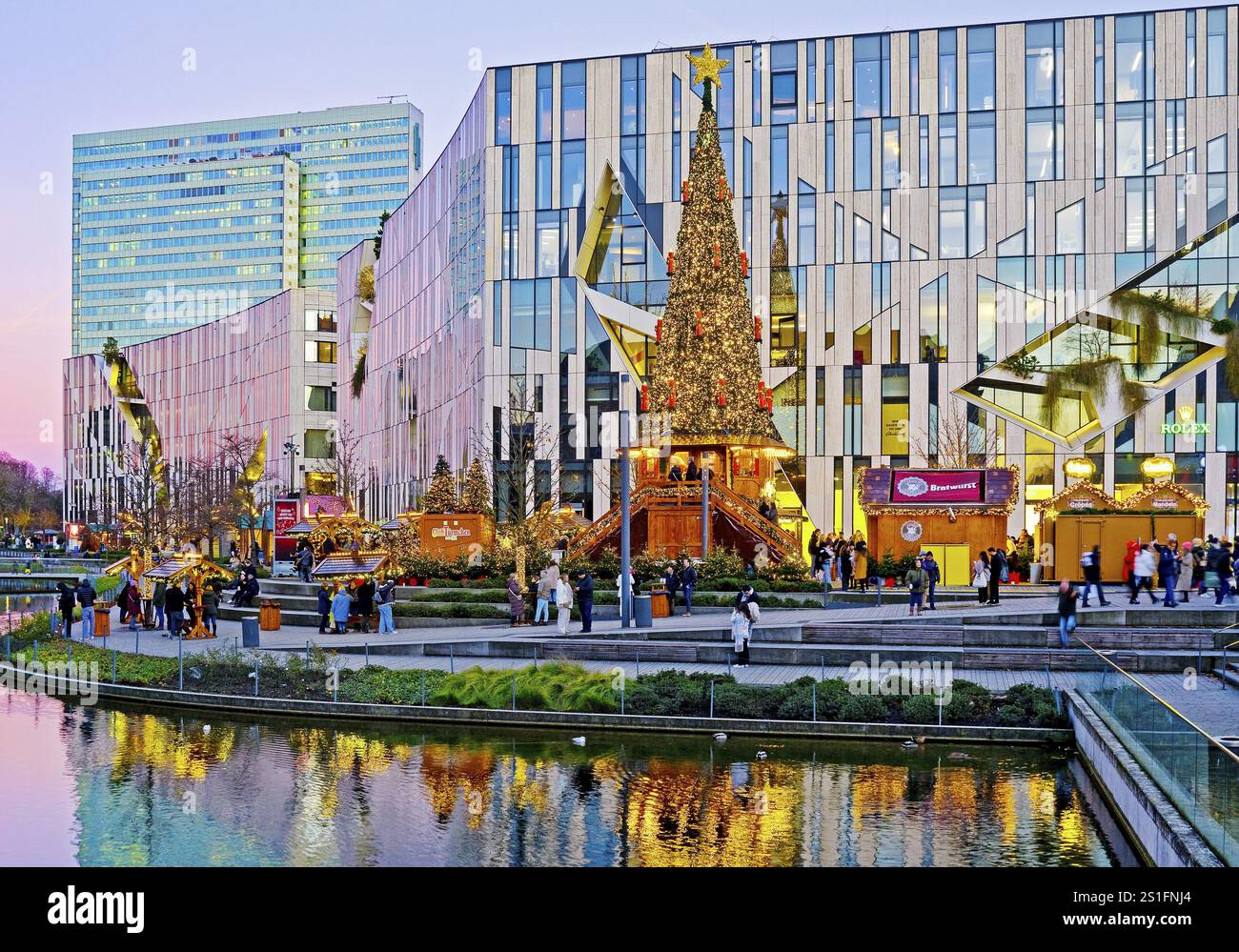 Dreischeibenhaus and Christmas market in front of the Koe-Bogen by ...
