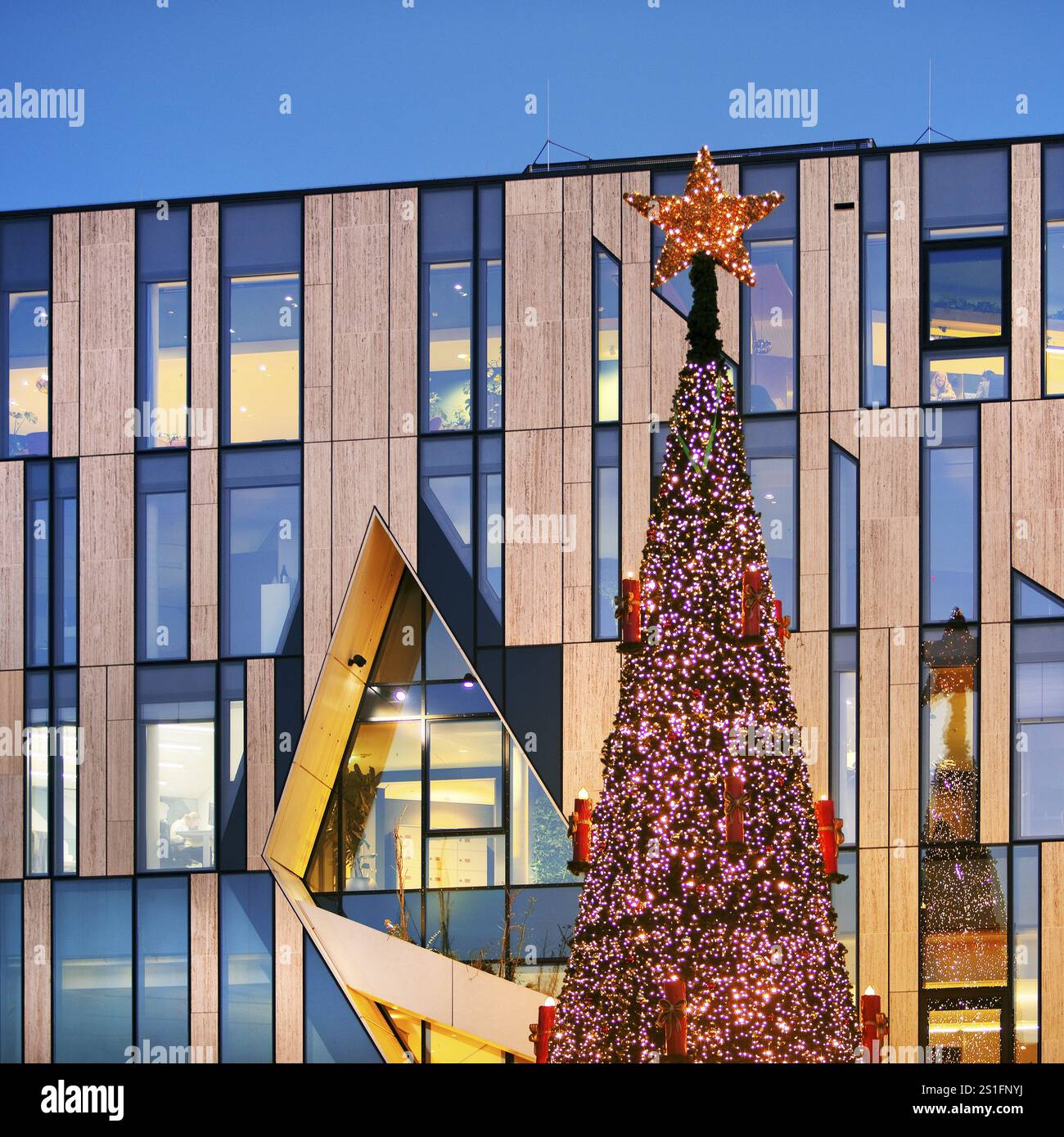 Christmas tree in front of the modern facade of the Koe-Bogen by ...