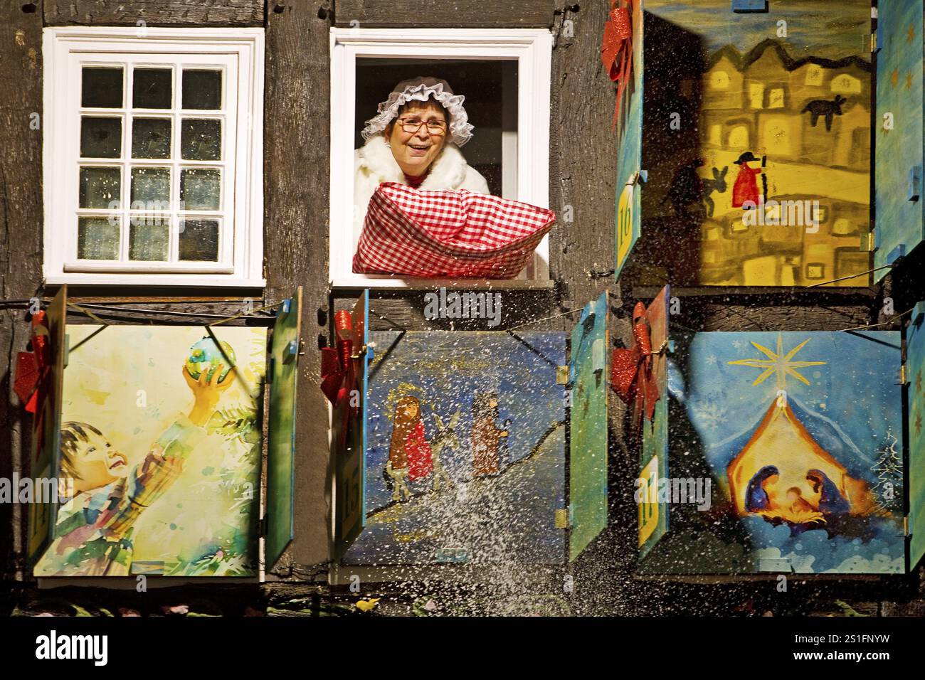 Mrs Holle shakes out her pillow at the big Advent calendar at the Old ...