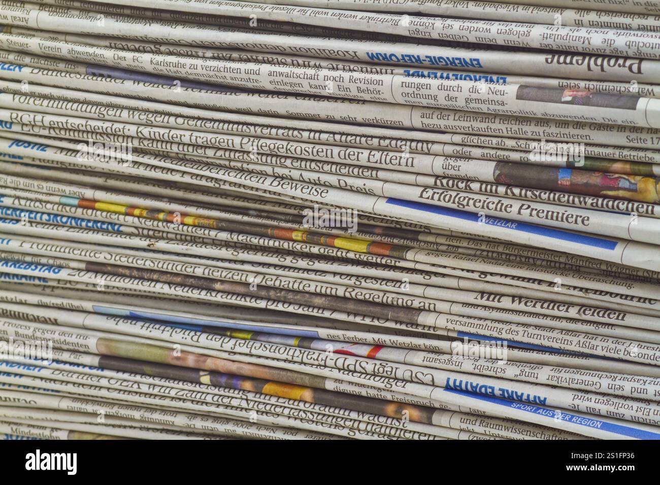 Pile of newspapers lying down Stock Photo - Alamy
