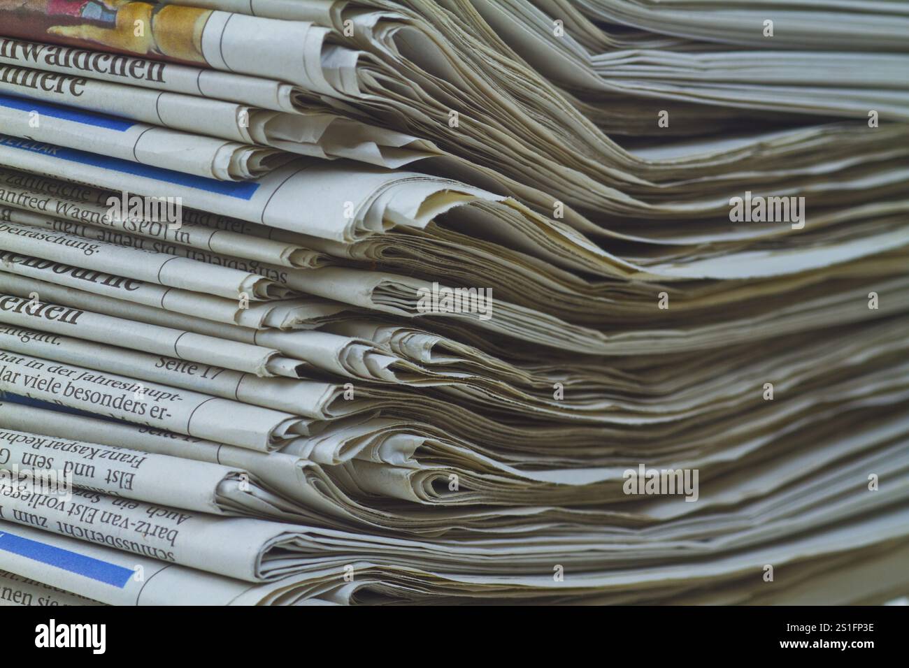 Pile of newspapers lying down Stock Photo - Alamy