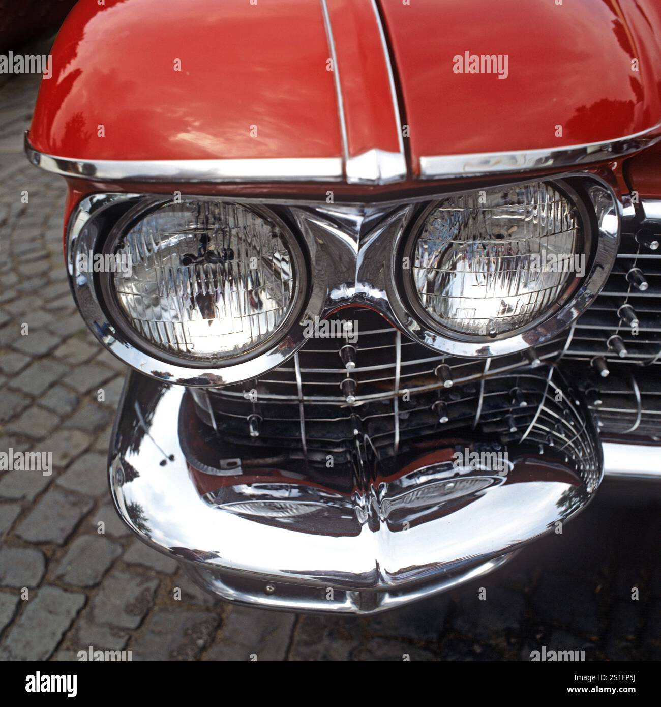 Close-up of twin headlights and bumper of an American road cruiser from ...
