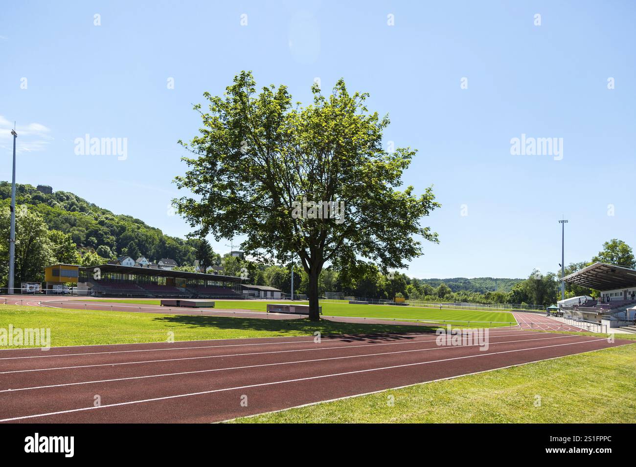 Cinder track in detail in a stadium in summer Stock Photo - Alamy