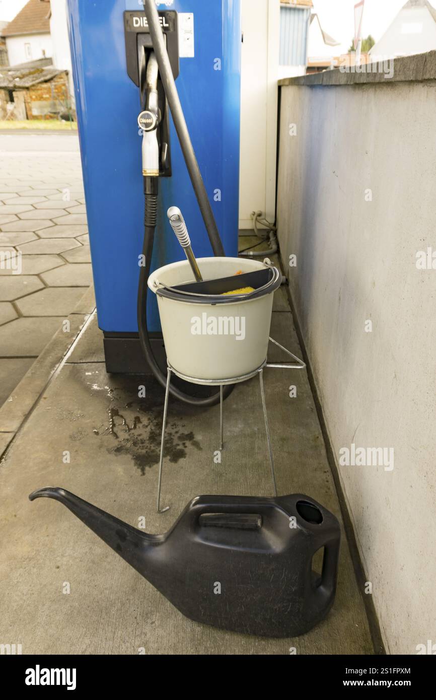People filling bucket water hi-res stock photography and images - Alamy