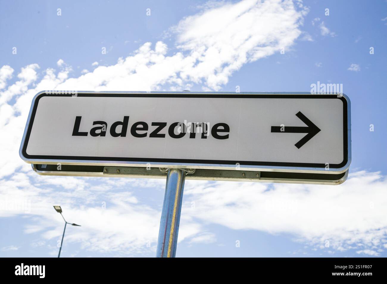 Loading zone sign on sky blue background Stock Photo - Alamy