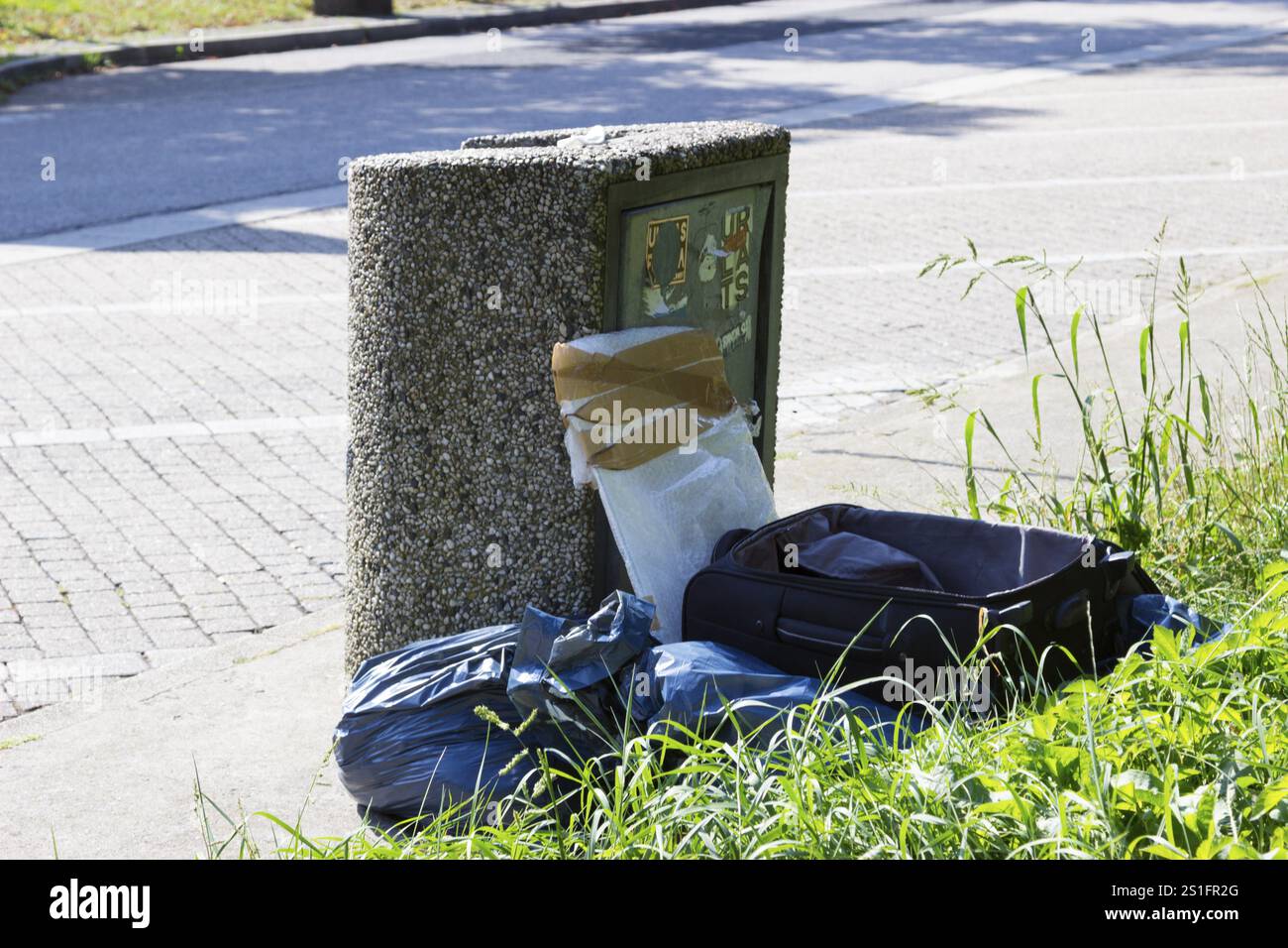 Illegal waste disposal at a motorway service area Stock Photo - Alamy