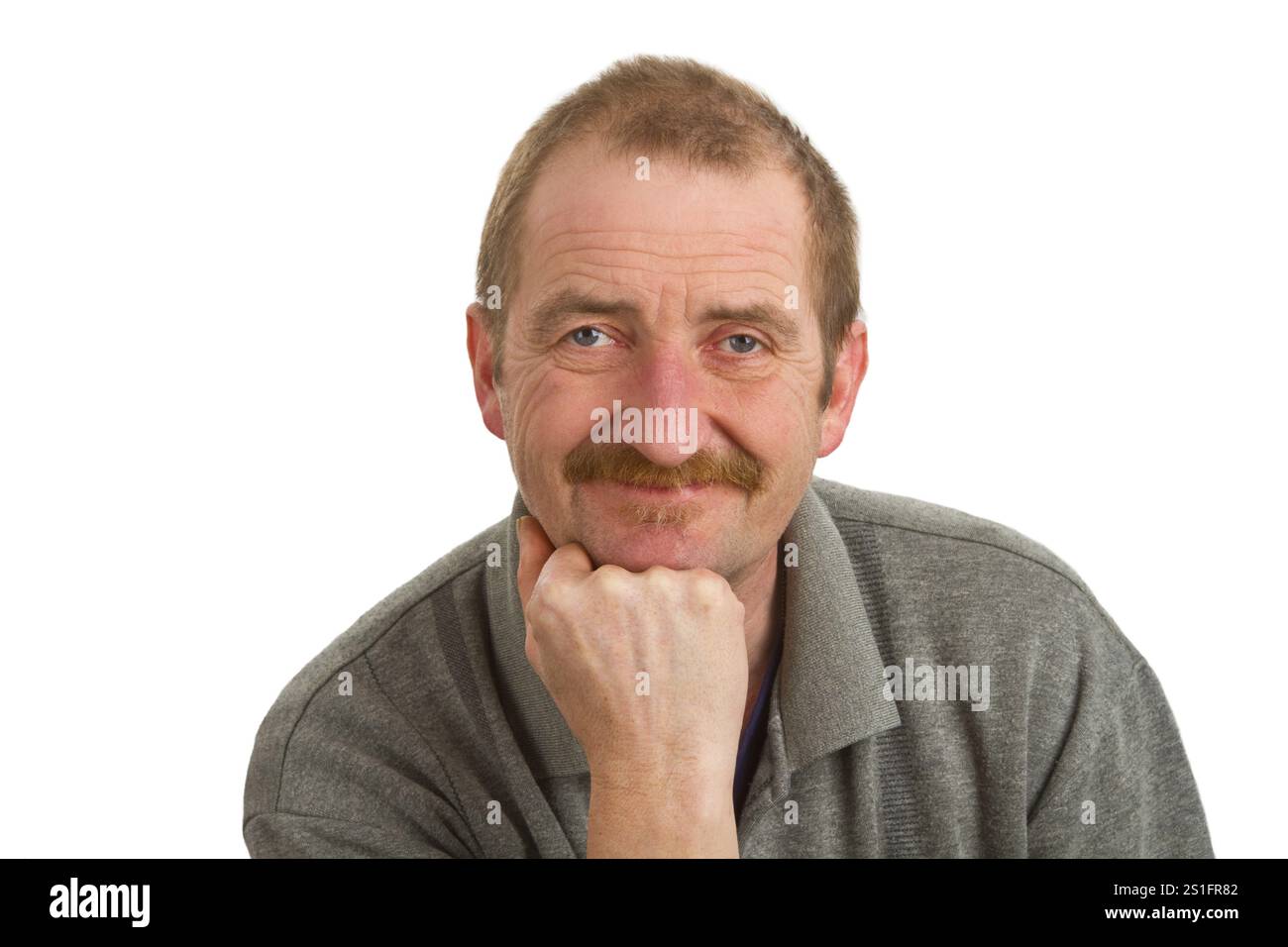 Man resting face on fist cropped on white background Stock Photo - Alamy