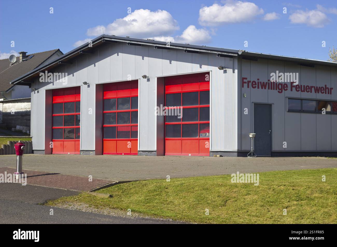 Three red Tor tor of a fire station Stock Photo - Alamy