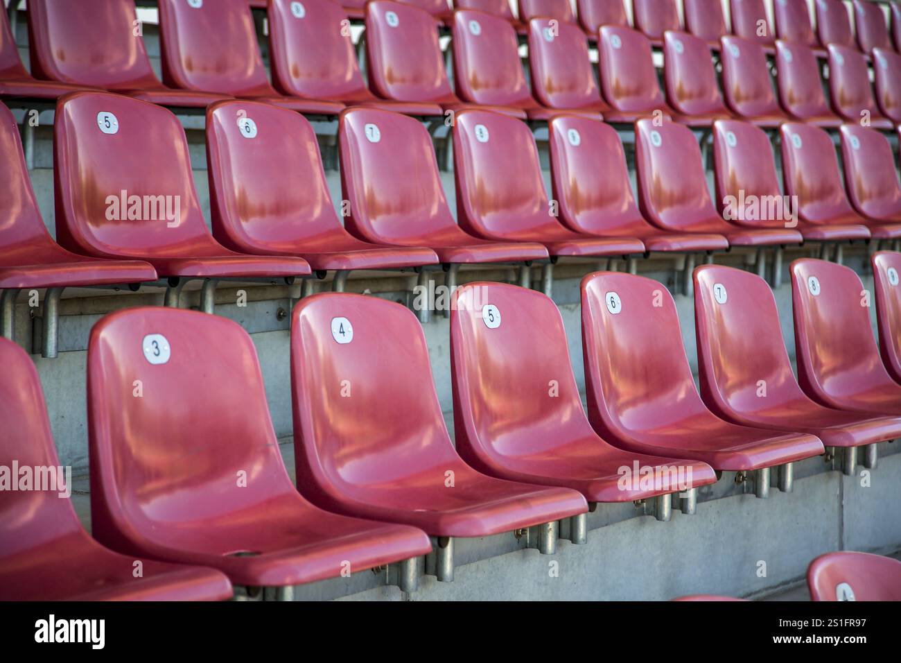Red rows of seats in detail in a stadium Stock Photo - Alamy