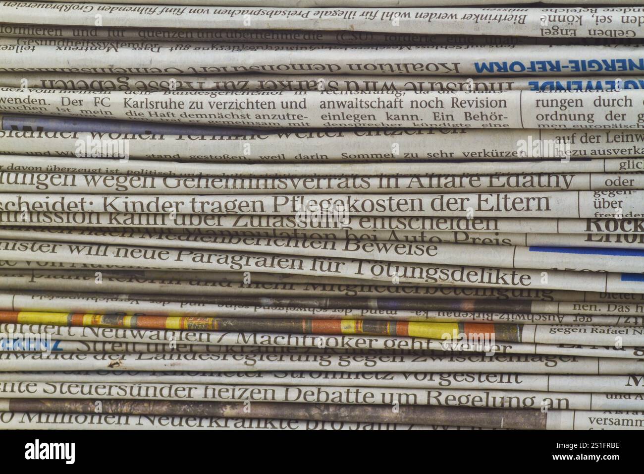 Pile of newspapers lying down Stock Photo - Alamy
