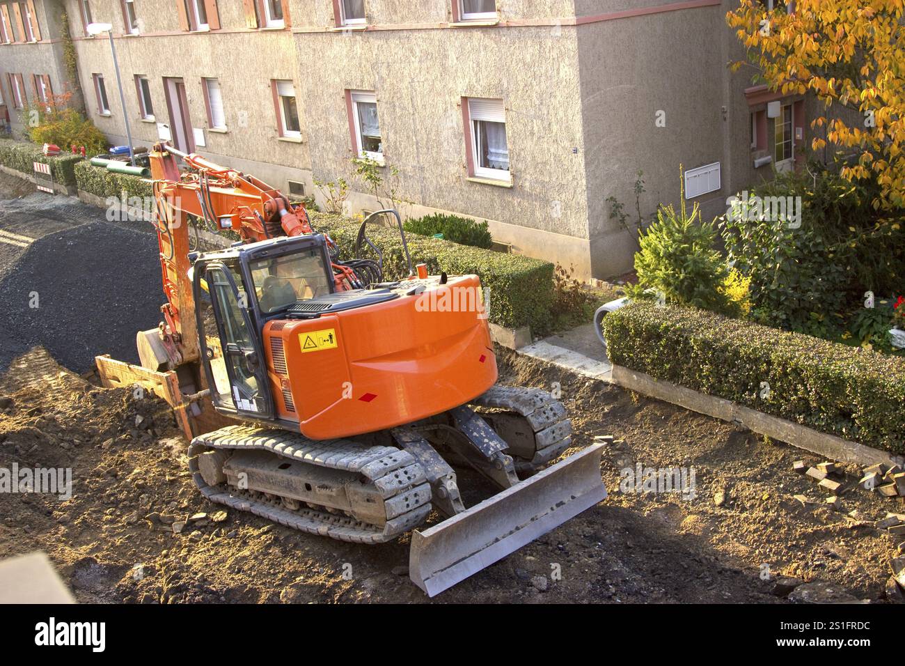 Excavator during road construction work Stock Photo - Alamy