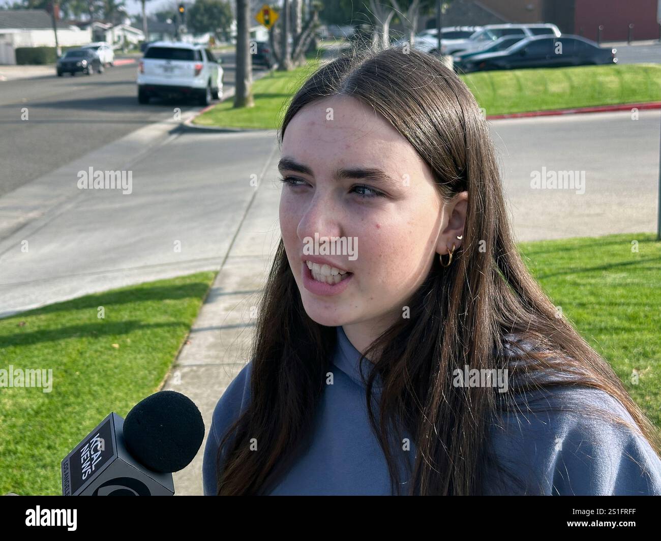 High School sophomore Maia Dadakis, 16, speaks about her friend Kelly Reid after a memorial at ...