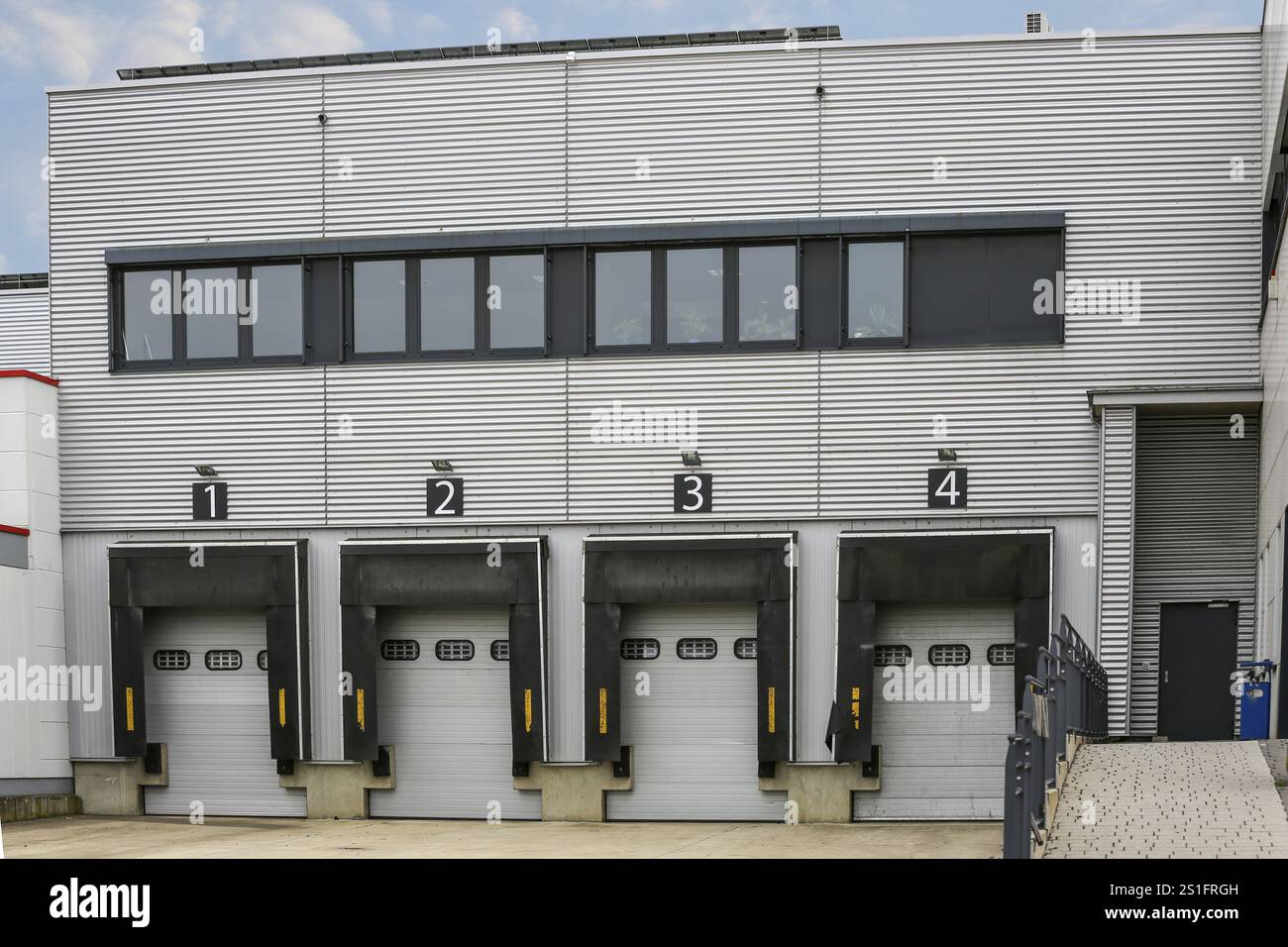 Roller shutters in a goods receiving area of a warehouse building Stock ...