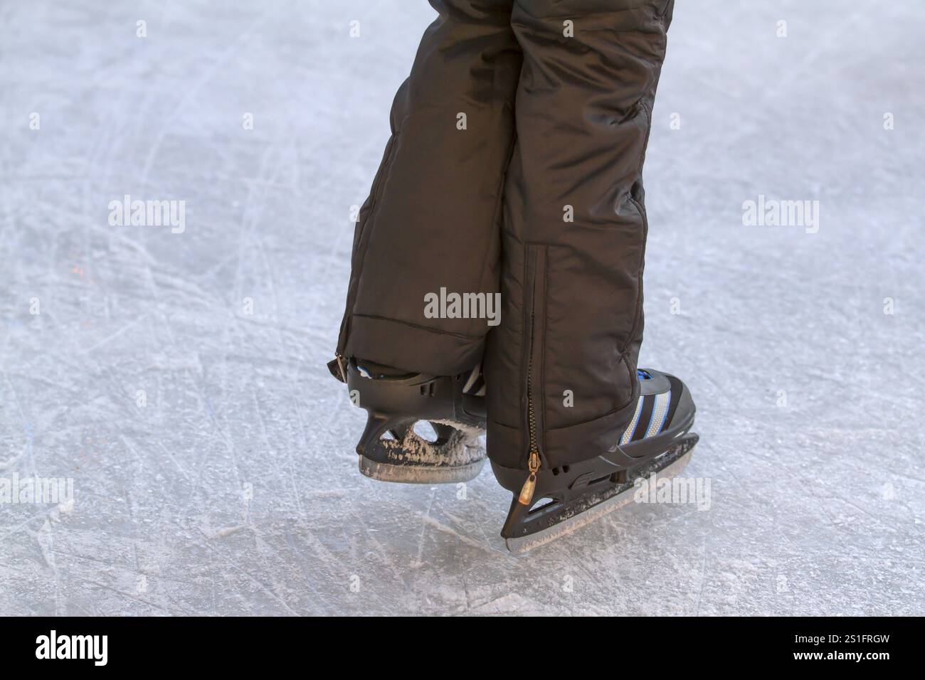 Skaters on an ice rink Stock Photo - Alamy