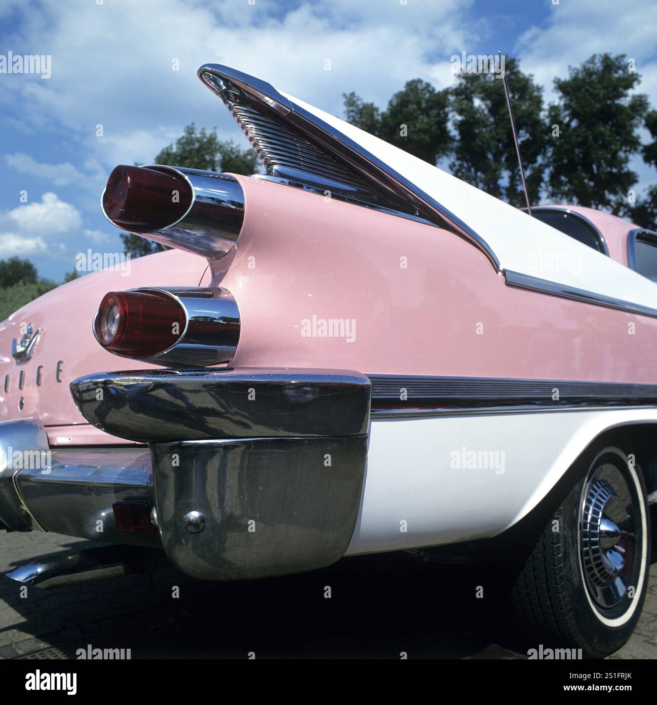 Dynamic perspective of an American road cruiser with tail fins and rear ...