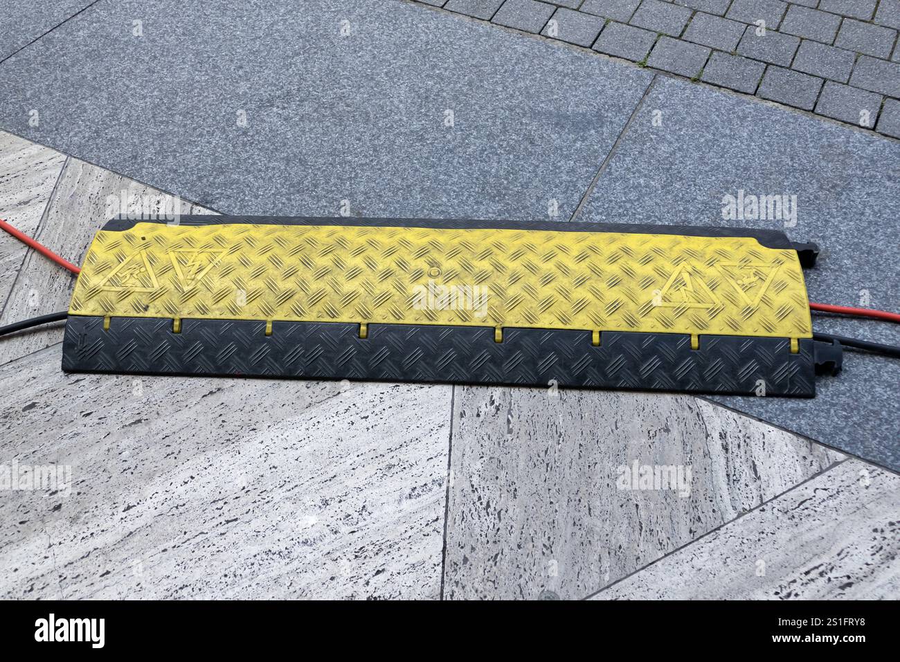 Cable bridge - trip protection with power cable on the floor Stock ...