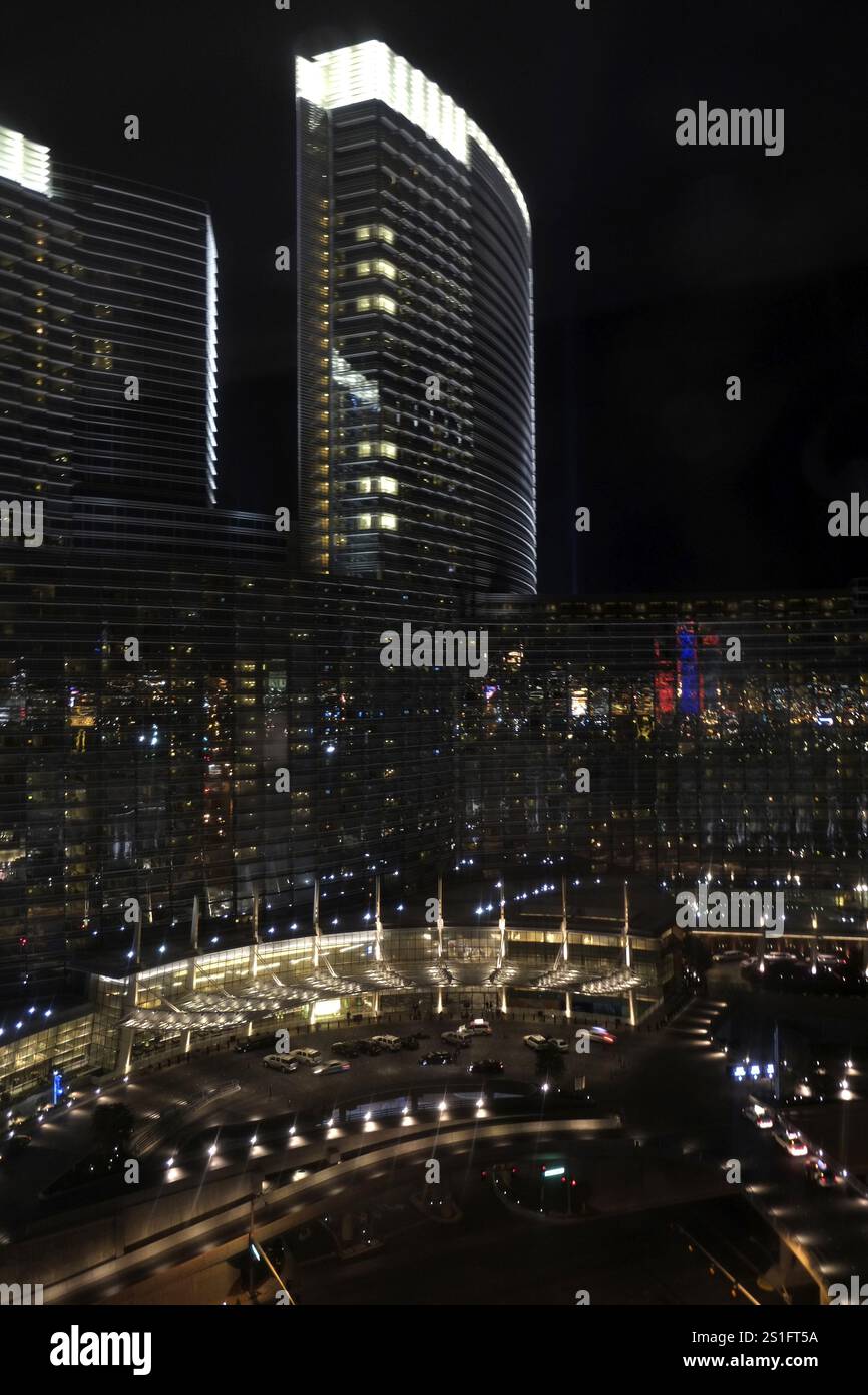 View from the hotel window on a brightly lit tower located opposite the ...