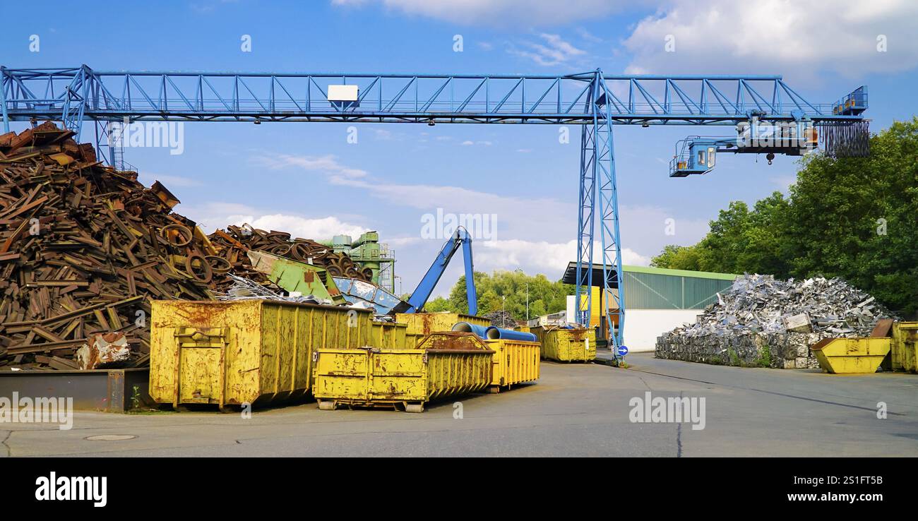 Site of a scrap yard with container and crane Stock Photo - Alamy