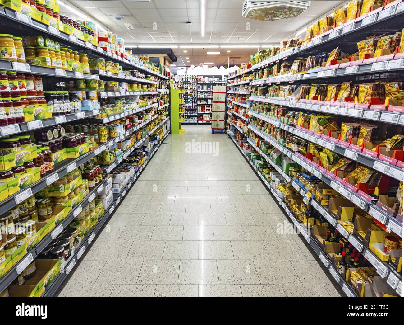HUETTENBERG, HESSE, Germany 12 05 2022: Aisle with shelves full of food ...