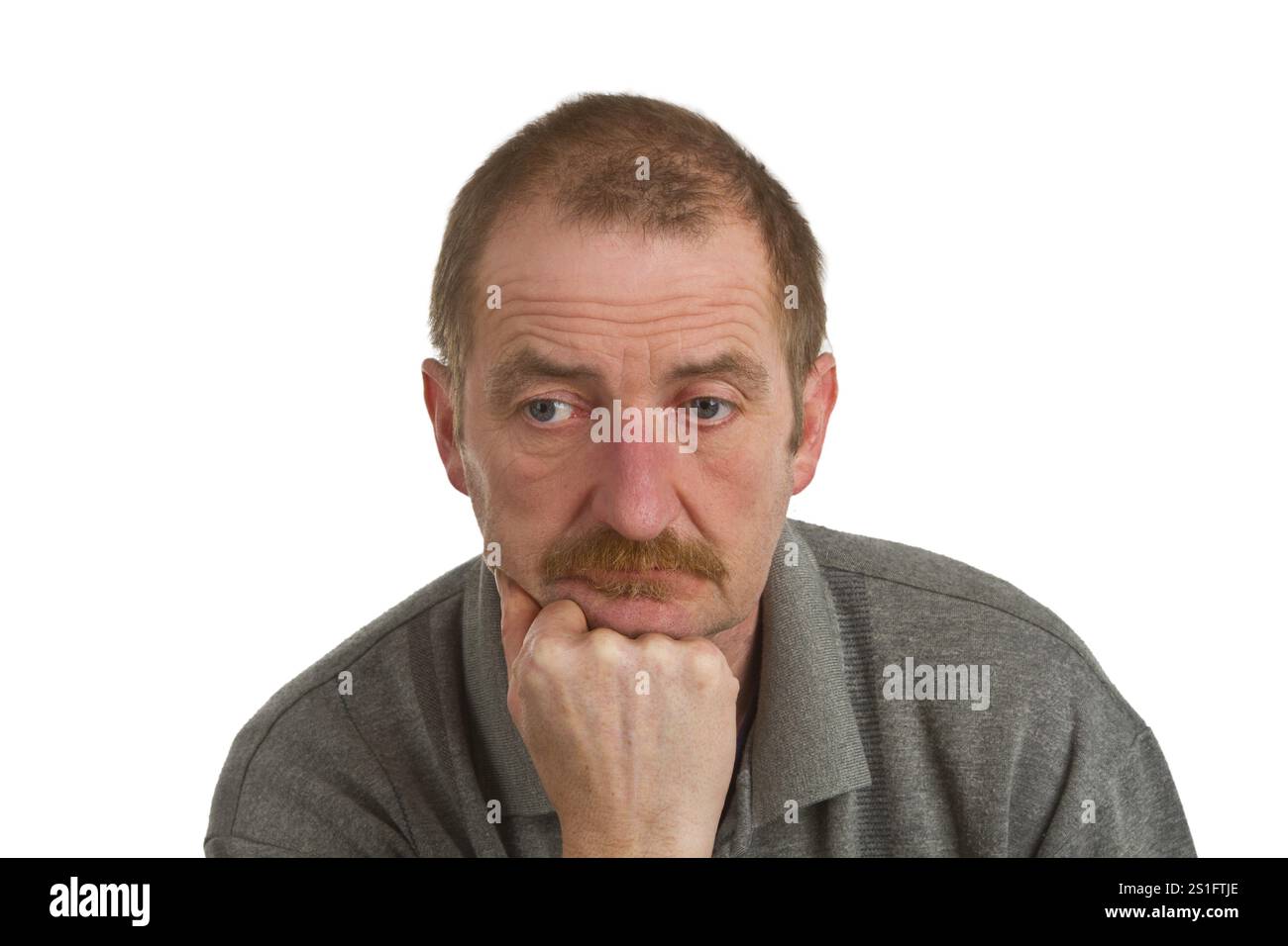 Man resting face on fist cropped on white background Stock Photo - Alamy