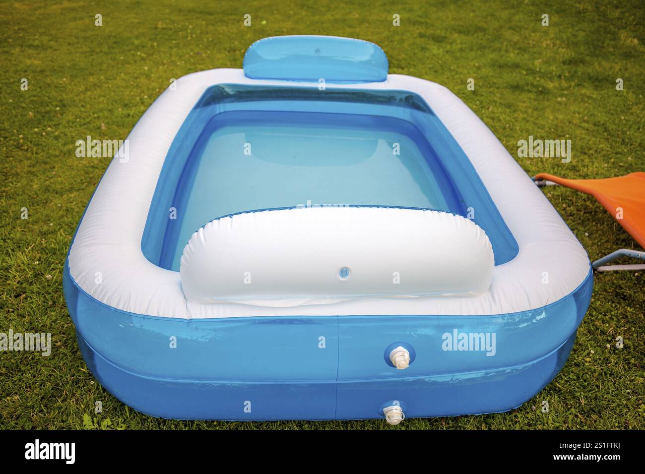 Paddling pool filled with water on a summer meadow Stock Photo - Alamy