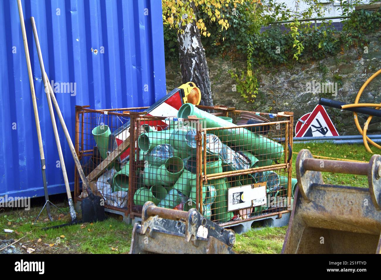 Waste water pipes in a lattice box Stock Photo - Alamy