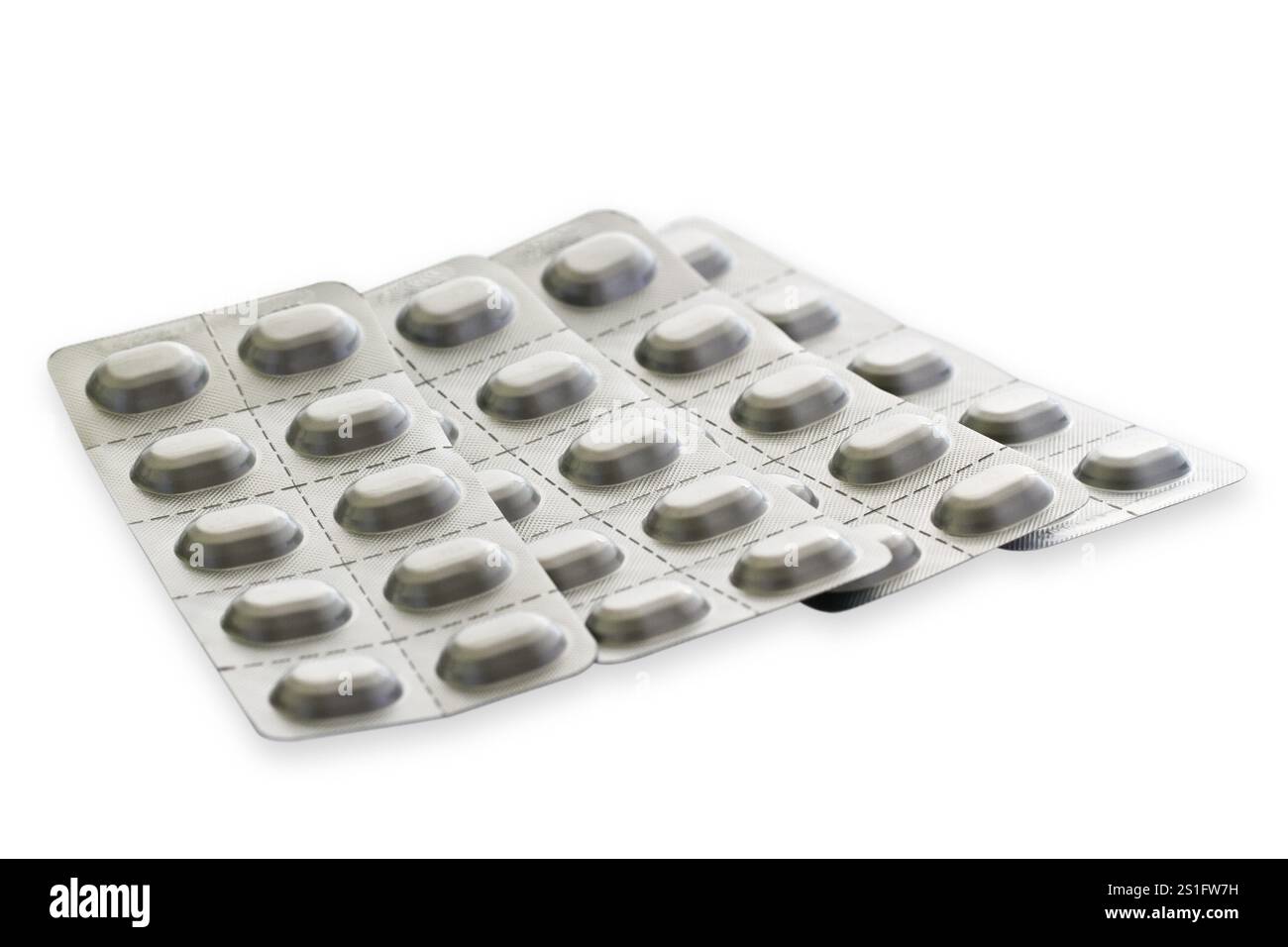Tablets in blister pack on white background Stock Photo - Alamy