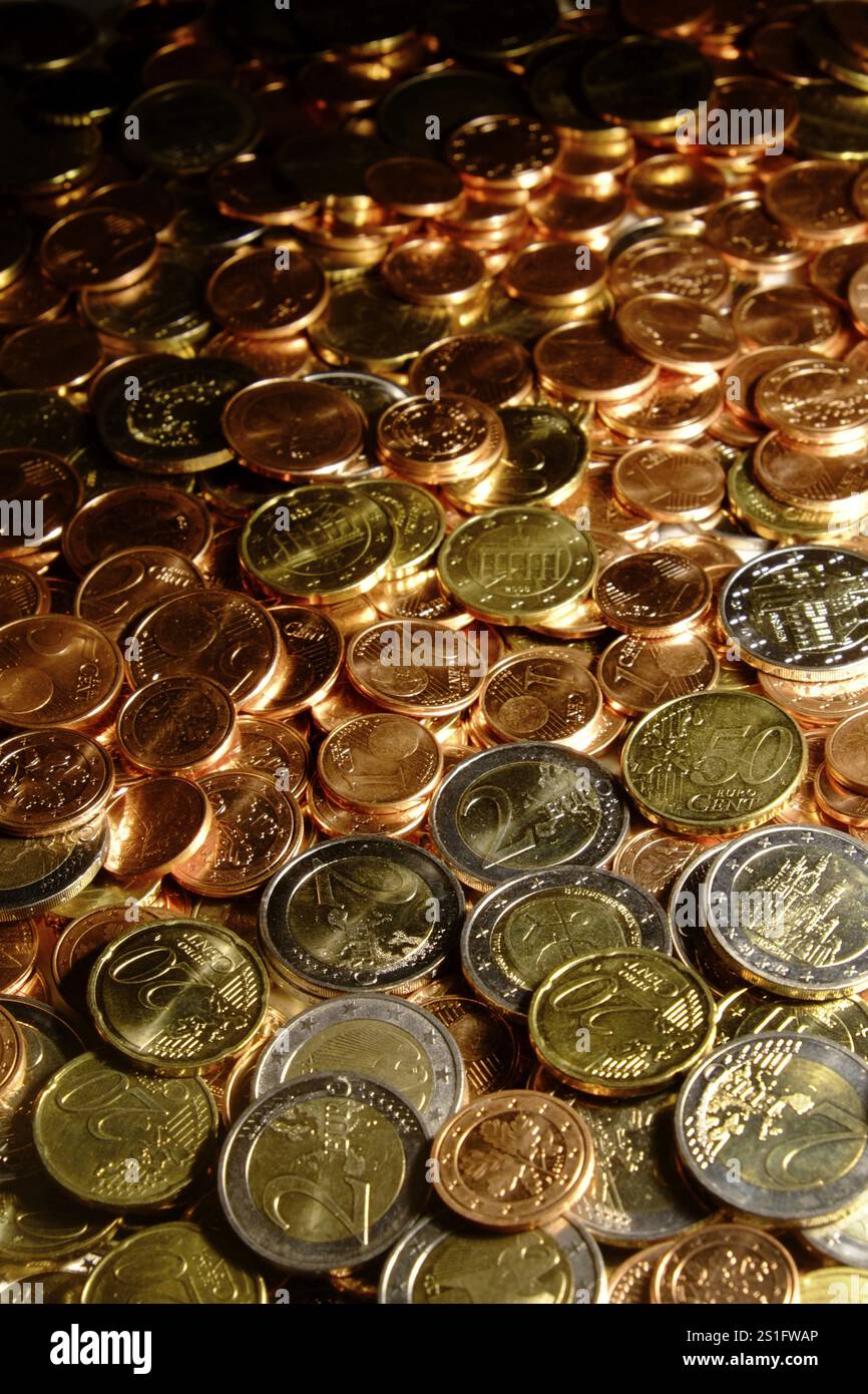 Euro coins of all denominations fill the motif. Portrait format. Euros ...
