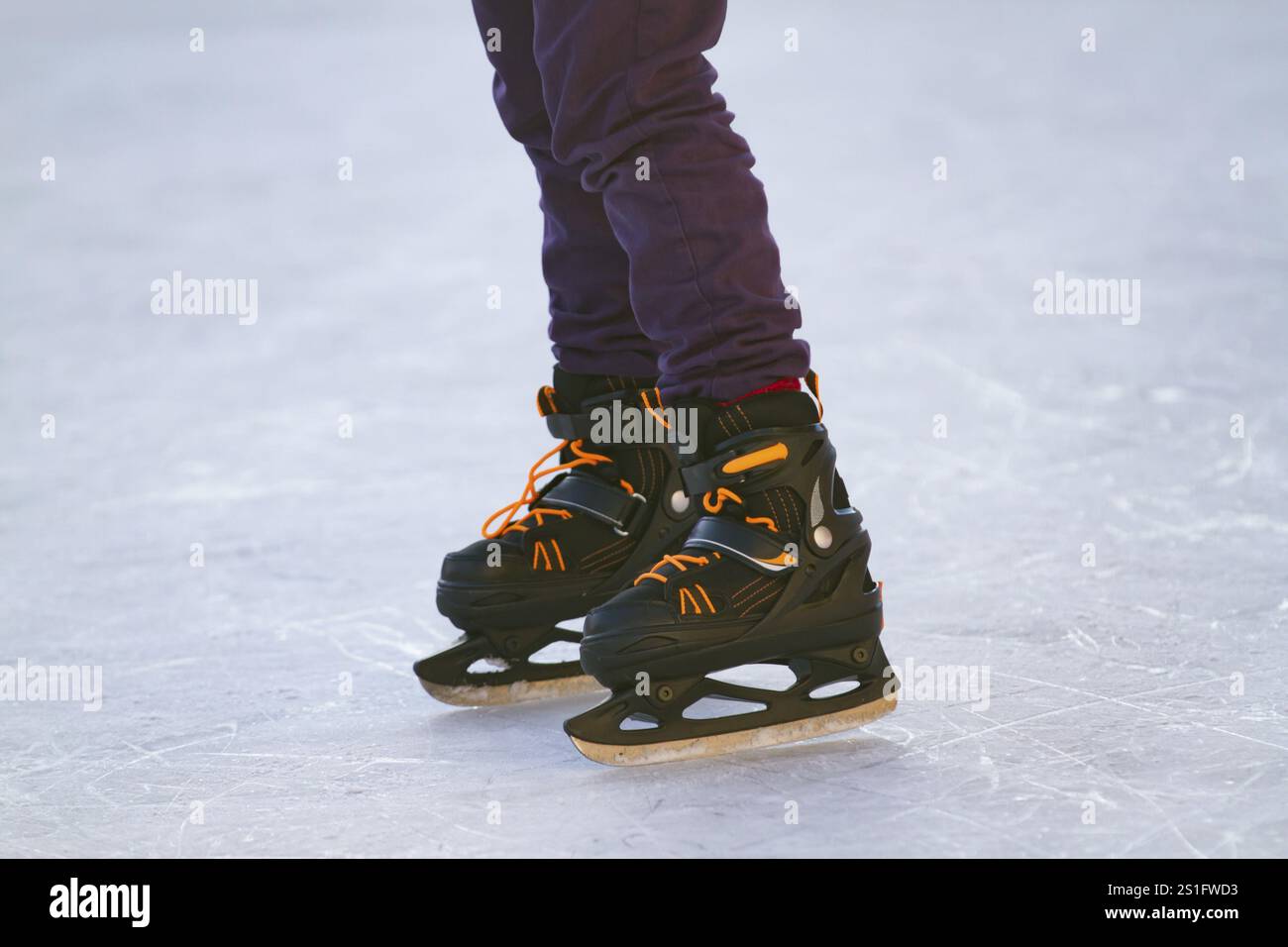 Skaters on an ice rink Stock Photo - Alamy