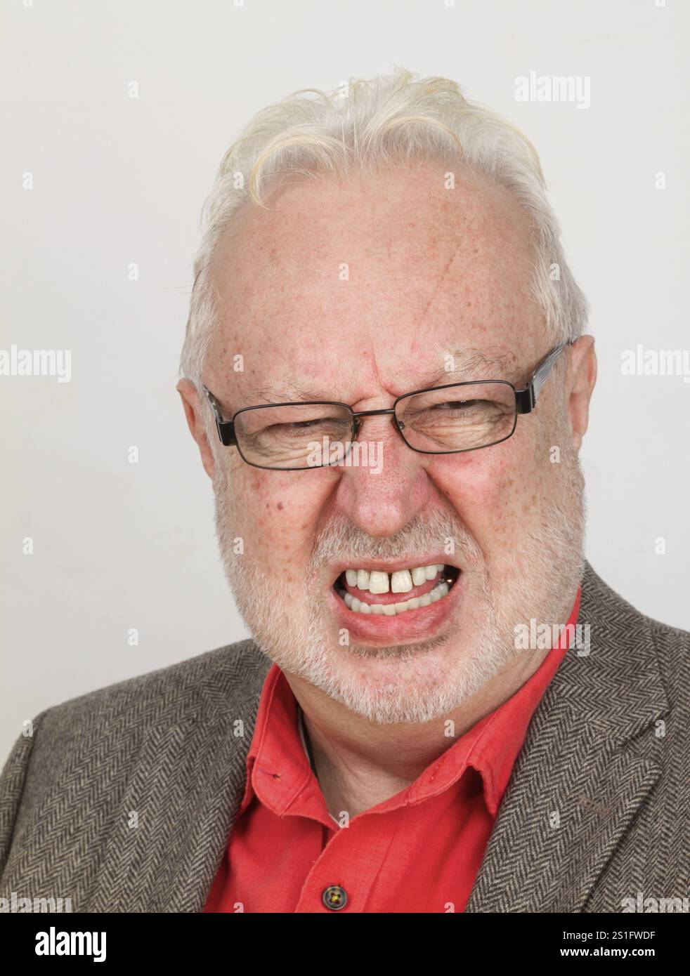 Angry senior bared his teeth on a white background Stock Photo - Alamy