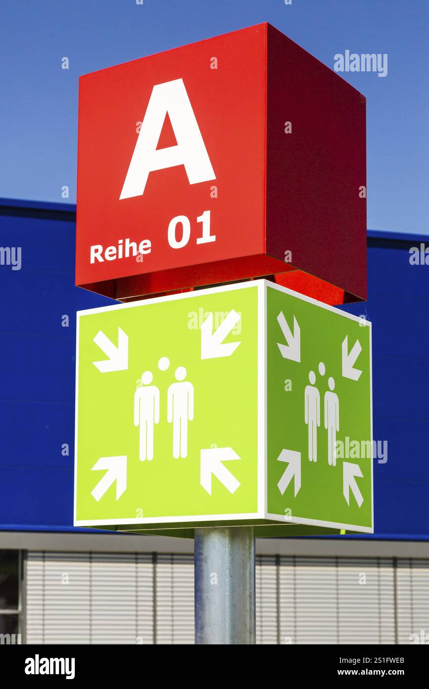 Pictogram of assembly point on green board Stock Photo - Alamy