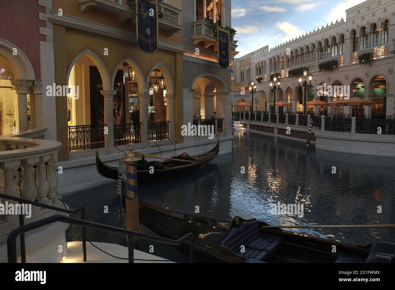 An attraction inside The Venetian hotel: gondolas on a canal lined with ...