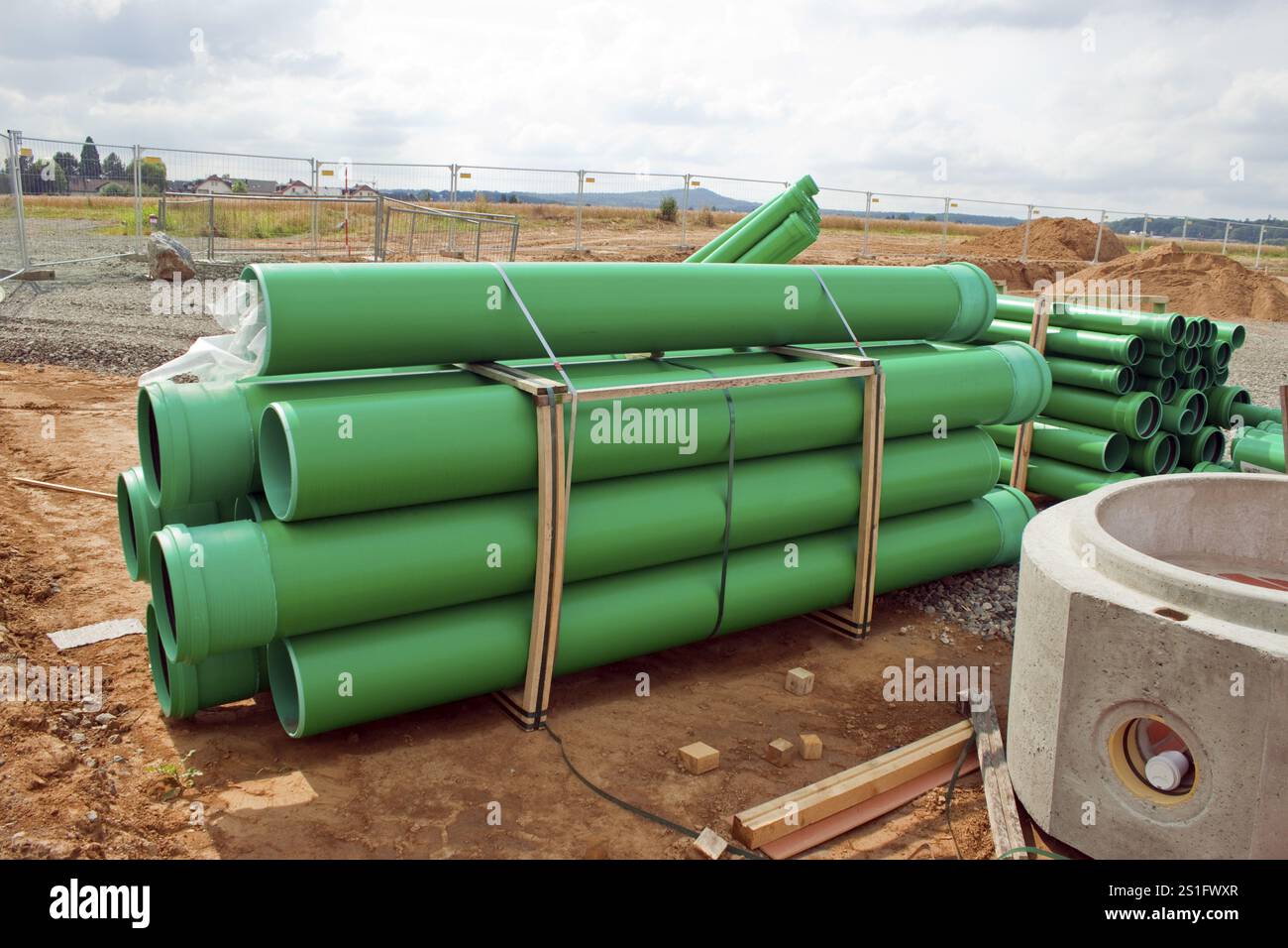Stacked green PVC sewer pipes Stock Photo - Alamy