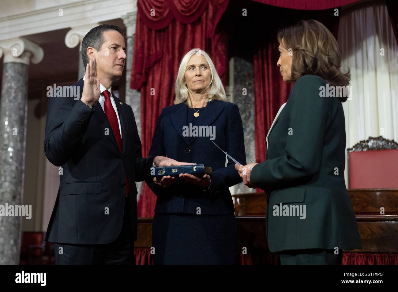 Sen. Bernie Moreno, R-Ohio, left, re-enacts being sworn in by Vice ...