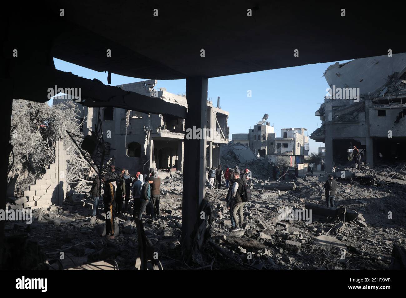 Maghazi Refugee Camp, Gaza Strip. 3rd Jan, 2025. People gather near ...