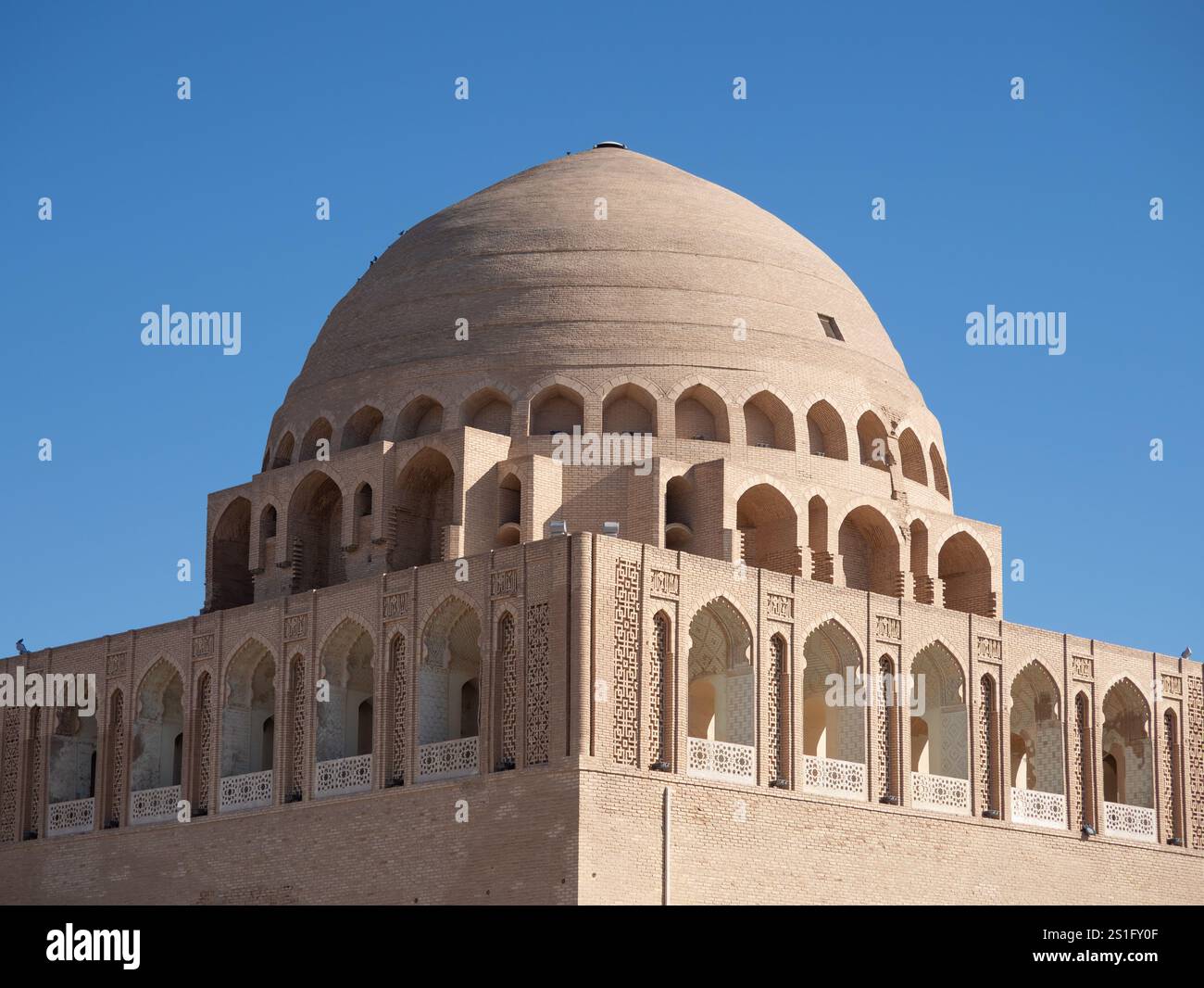 Close up of the earthen brick dome and walls with multiple arched ...