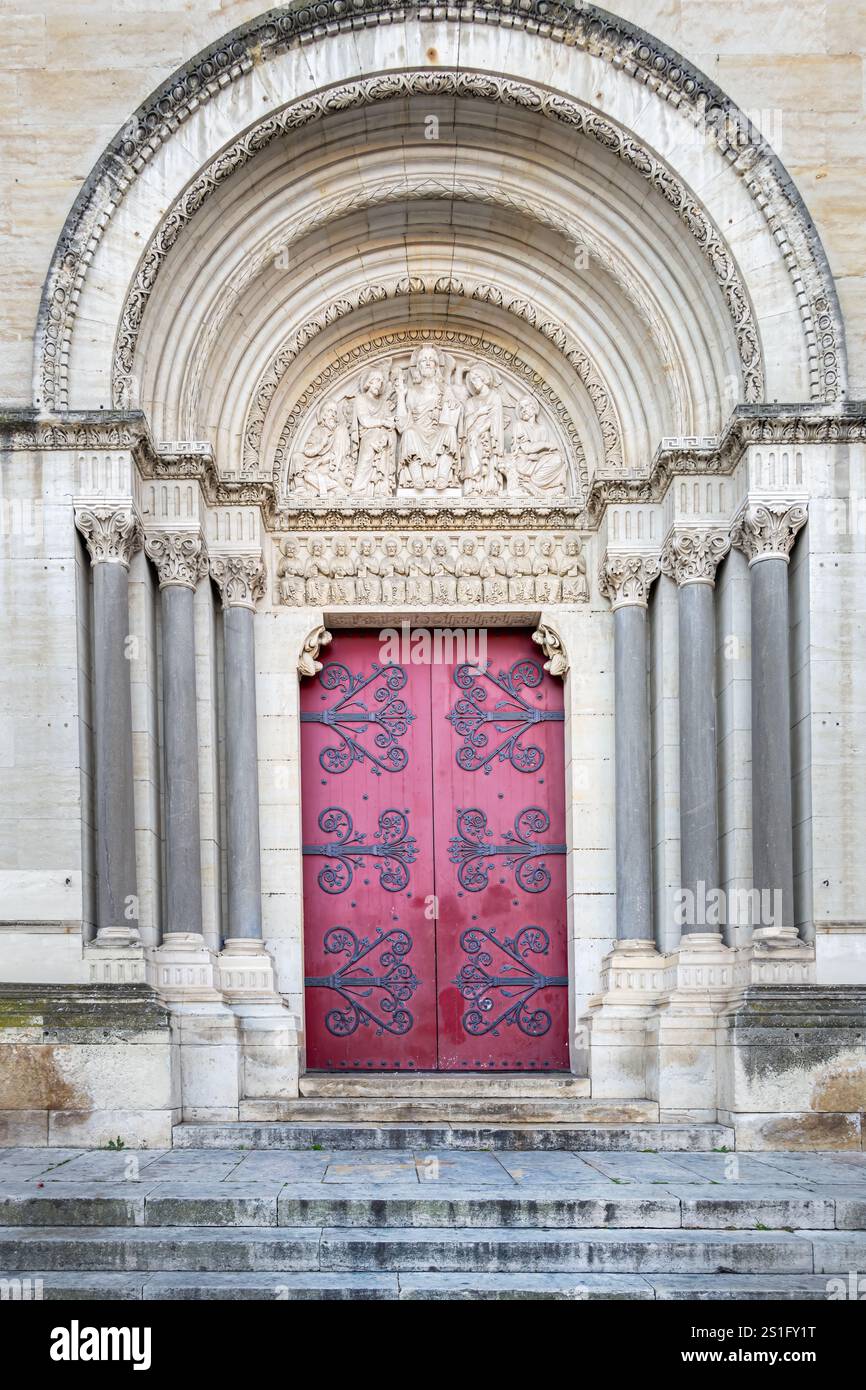 Wooden door of St Paul church in Nîmes, with its wrought ironwork and ...