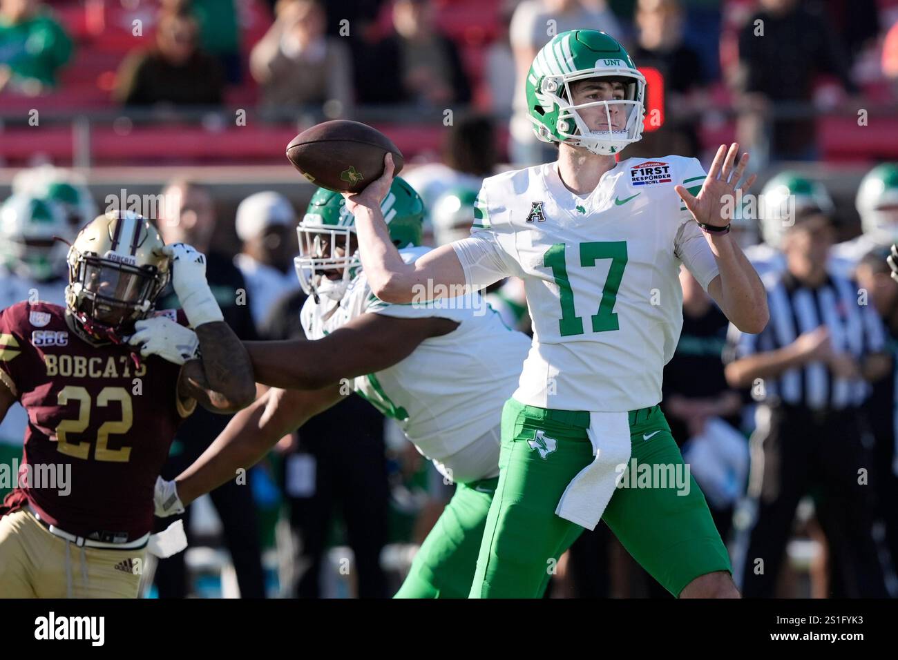 Texas State quarterback Drew Mestemaker (17) passes as teammate ...