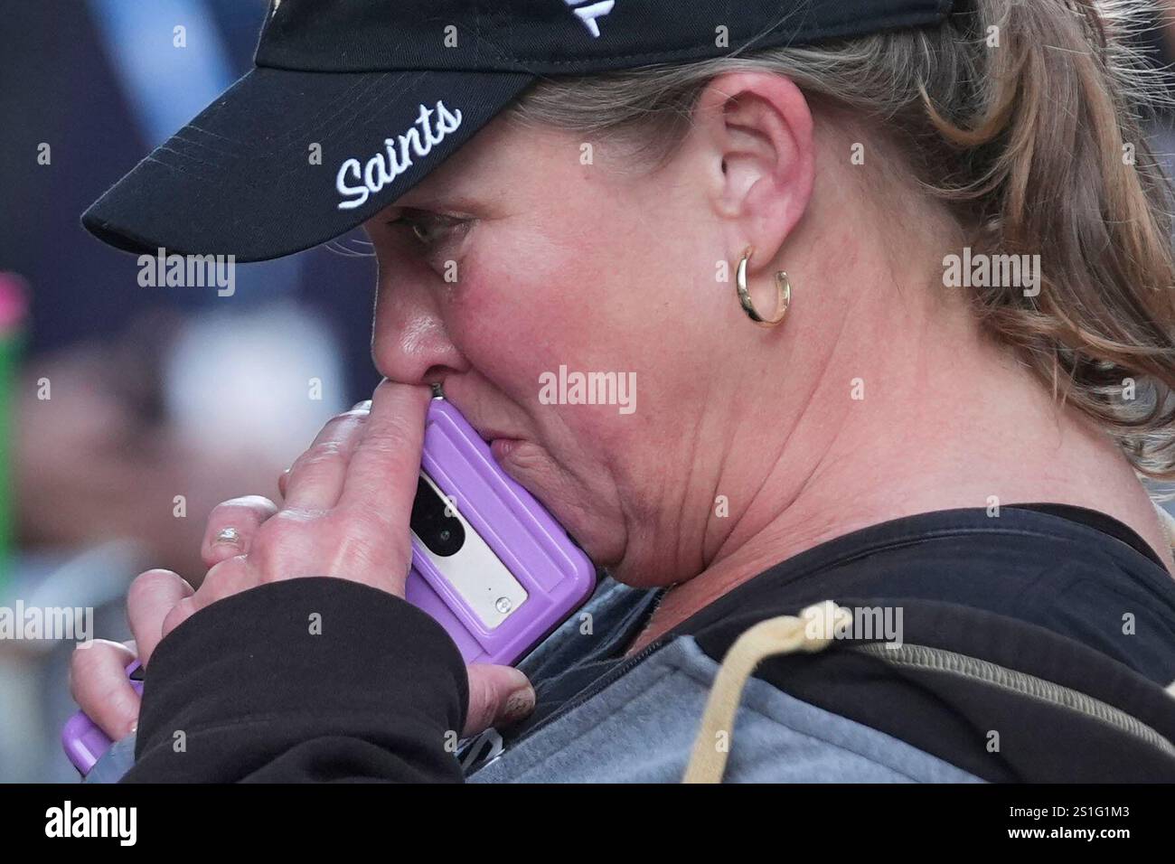 Alisa Kuhns, visiting from Santa Rosa, Calif. reacts at memorial on ...