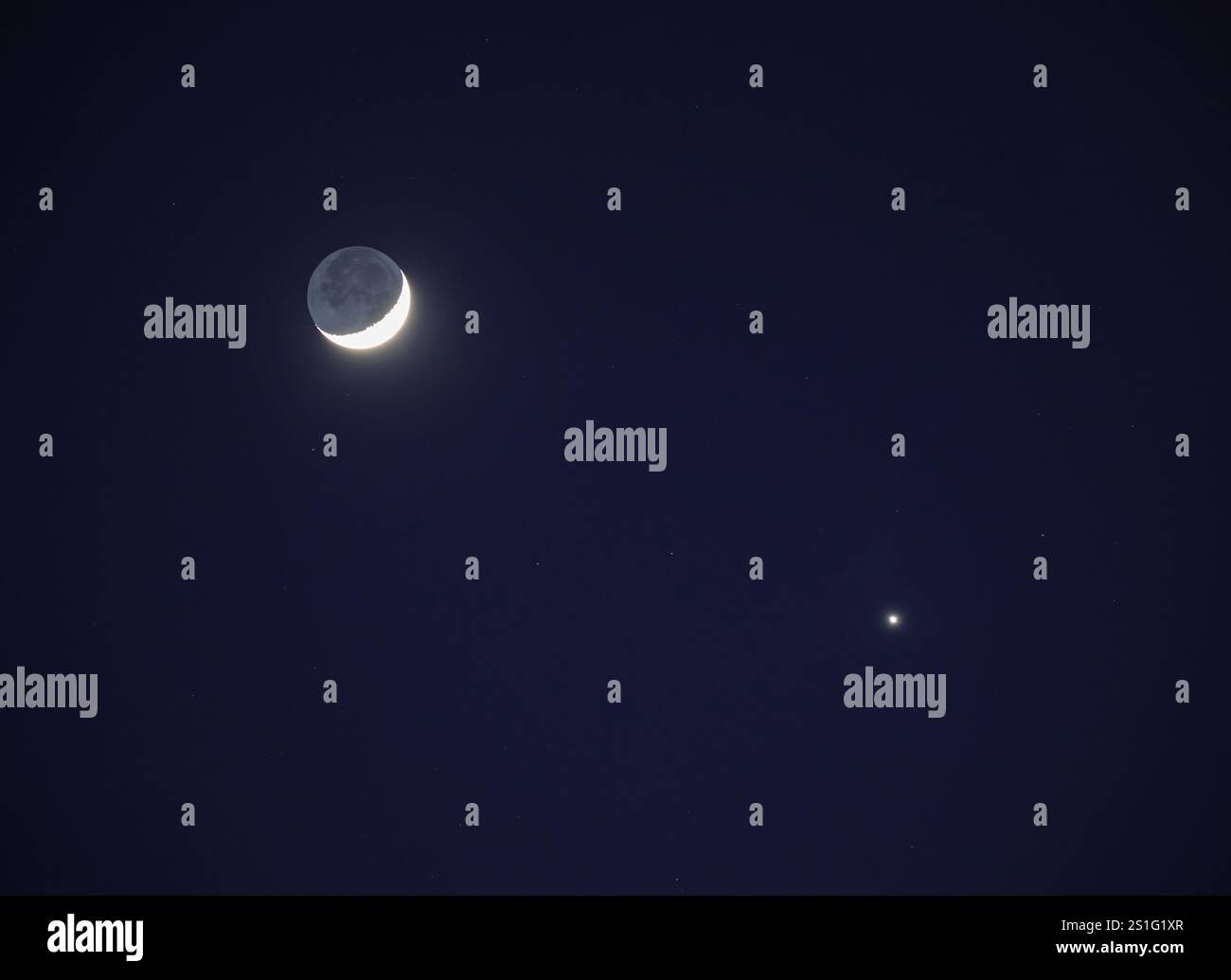 The planet Venus in close proximity to a crescent moon shortly after ...