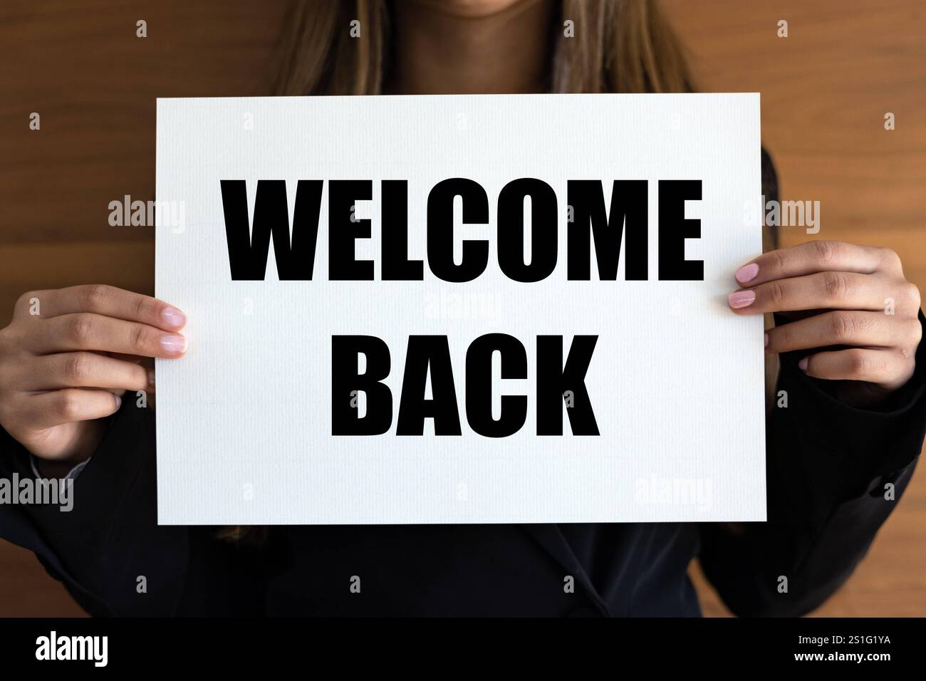 Welcome Back Welcome back. Woman with white page, black letters ...