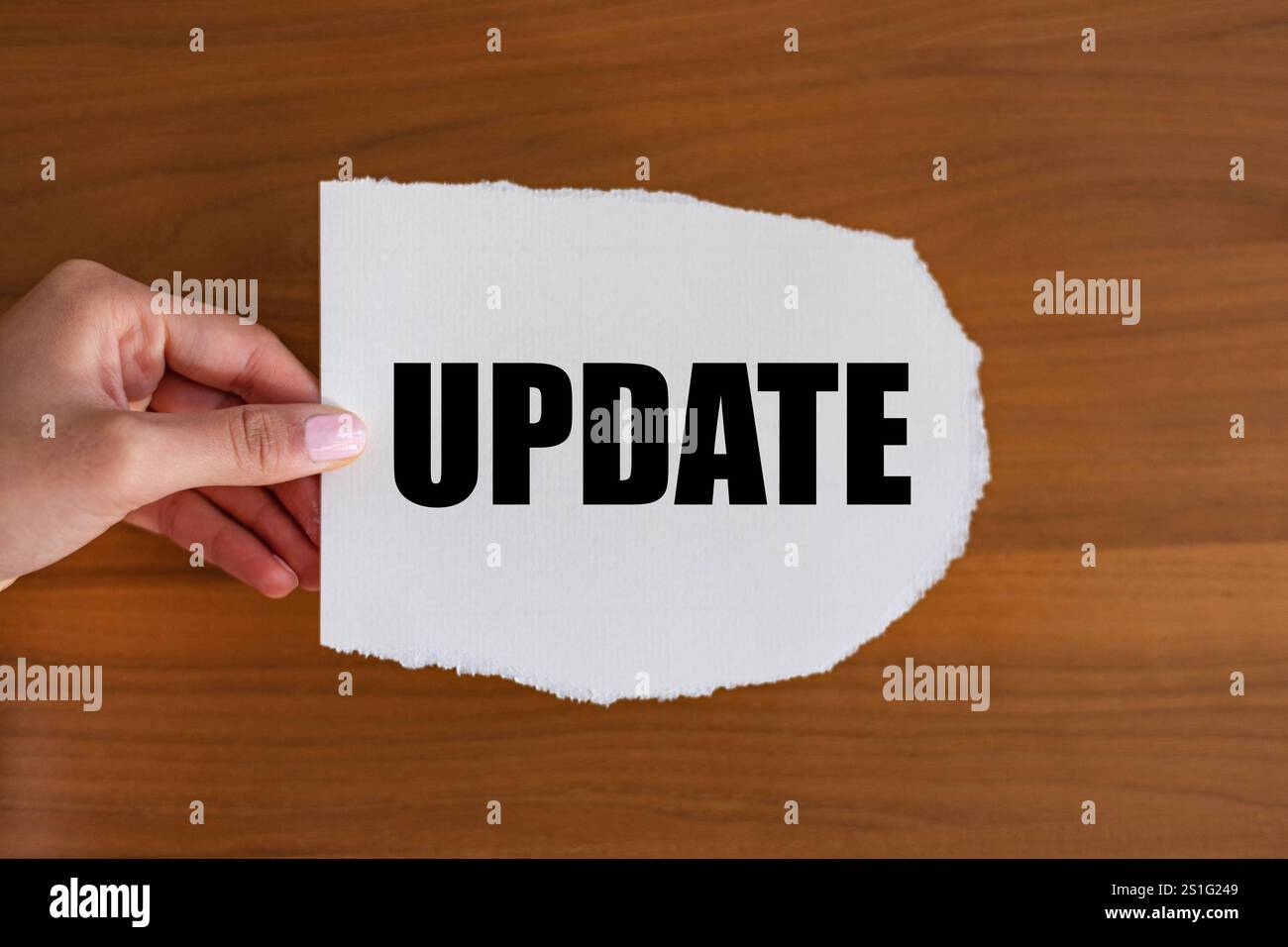 Update Update. Woman hand holds a piece of paper with a note, update ...