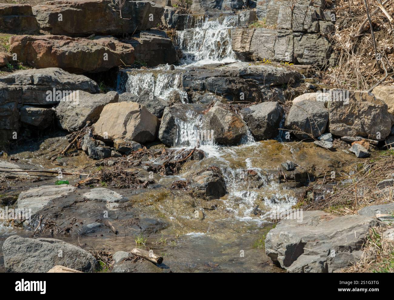 Water stream with rocks and rushing waters Stock Photo - Alamy