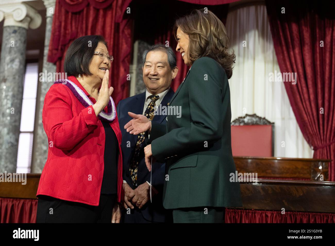 Sen. Mazie Hirono, D-Hawaii., left, re-enacts being sworn in by Vice ...