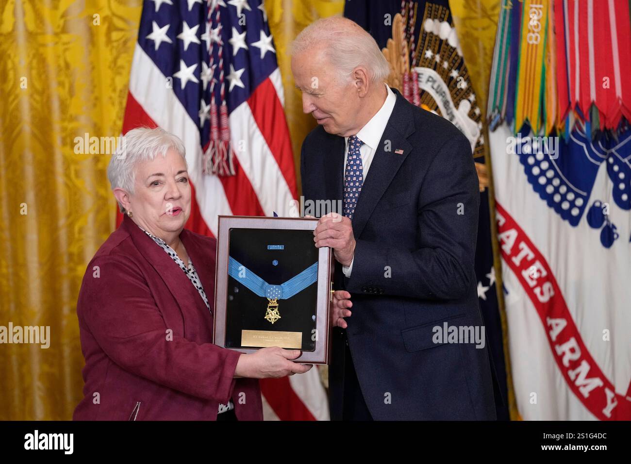 President Joe Biden, right, talks with Laura Blevins, left, after ...