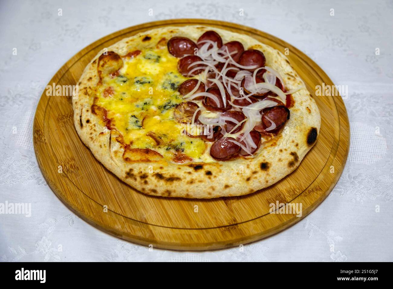 Traditional Brazilian pizza half four cheese and half pepperoni with ...